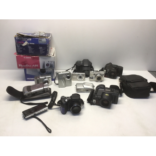 Mixed vintage and digital cameras including Olympus Camedia, Canon ...