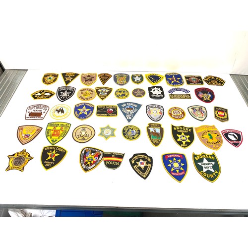 Large collection of vintage american police patches.