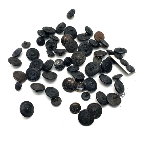 Large quantity of black military and police buttons.