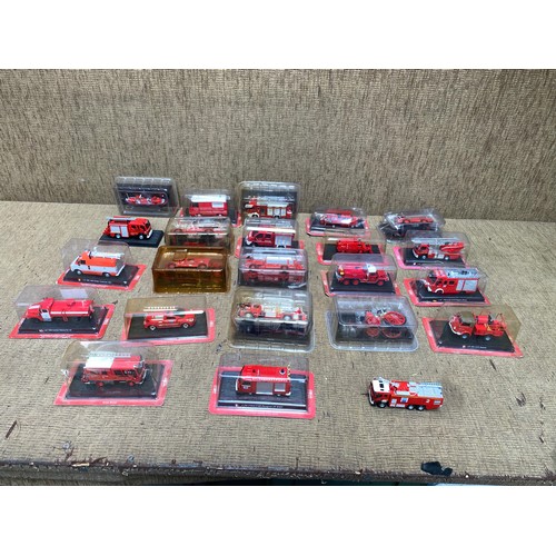 Large collection of scale model die cast fire engines.