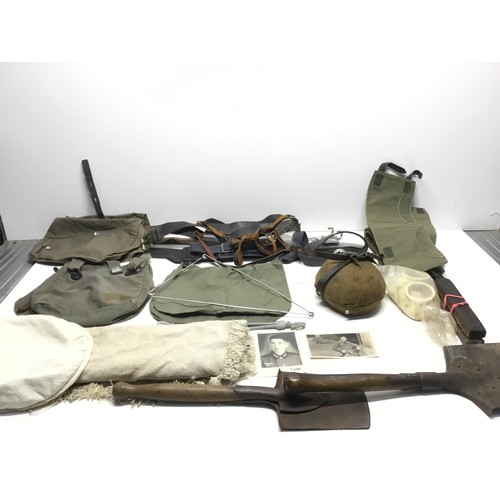 A collection of WW2 German army equipment including water bottles and ...