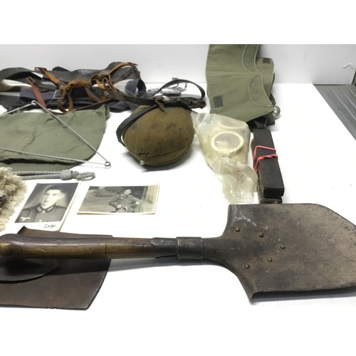 A collection of WW2 German army equipment including water bottles and ...