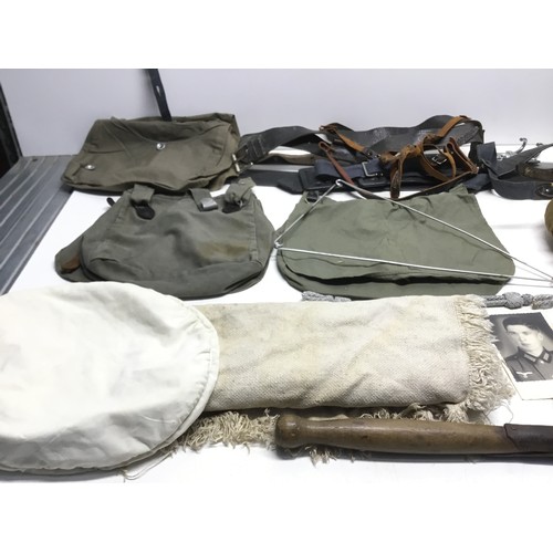 A collection of WW2 German army equipment including water bottles and ...