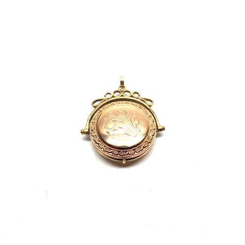 9ct yellow and rose gold swivel locket. 5.2g.
