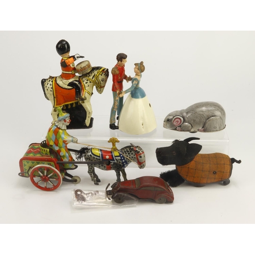 Clockwork. A group of six various clockwork toys, including a Schuco ...