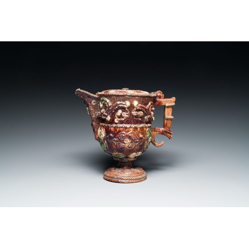 A French polychrome lead-glazed earthenware puzzle jug, Saintonge, 1st half 17th C.Description:L.: 2