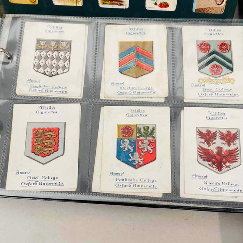 Three album binders housing several hundred early-20th-century ...