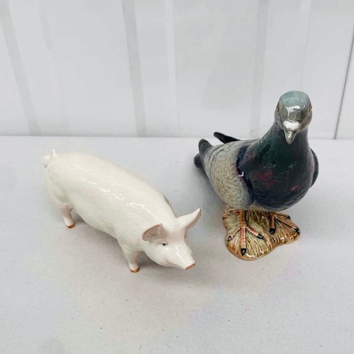 Pair of Beswick glazed porcelain animal figures: a standing white pig ...