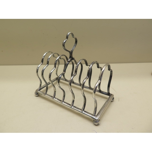 A silver toast rack London 1908/09 - Length 13cm - approx weight 4.7 ...