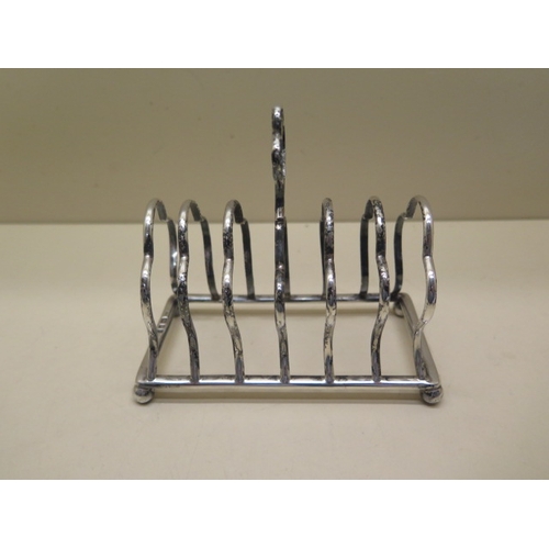 A silver toast rack London 1908/09 - Length 13cm - approx weight 4.7 ...
