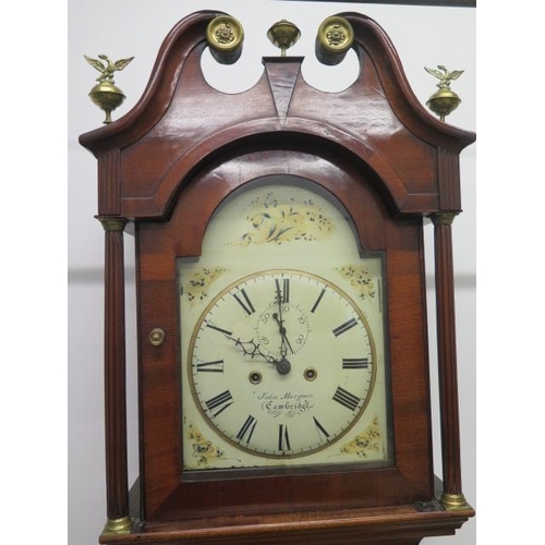A 19th century longcase clock with a painted arched dial with second ...