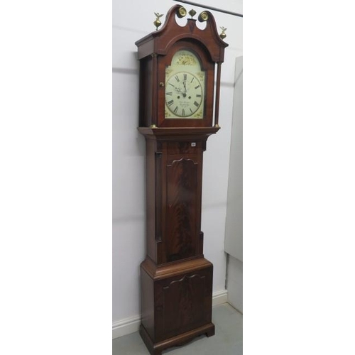 A 19th century longcase clock with a painted arched dial with second ...