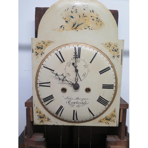 A 19th century longcase clock with a painted arched dial with second ...