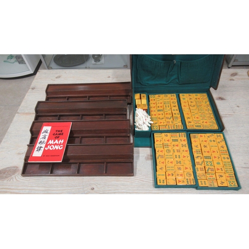 A vintage Mahjong set in leather case with four counter trays and table ...