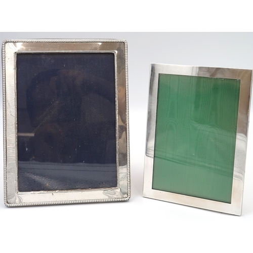 One Silver H.M. photo frame and one Sterling Silver. 18cm x 13cm and ...