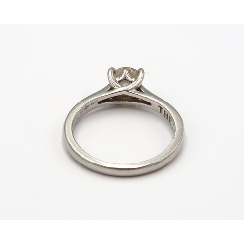 A platinum Leo diamond solitaire ring, stamped 950, the diamond with an ...
