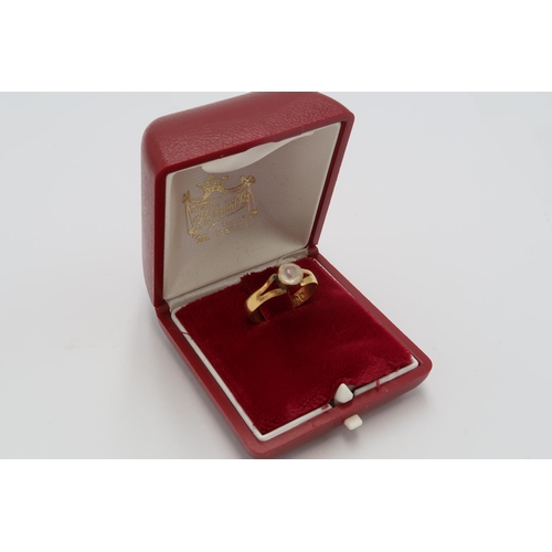 A 22ct gold and clear crystal set ring, the solitaire stone in collet ...