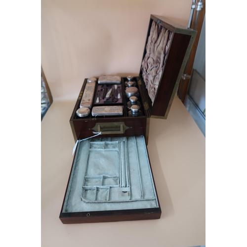 A George IV brass bound mahogany dressing table box, having perced and ...