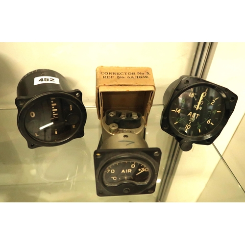 A group of four WWII period aircraft instruments, likely military ...