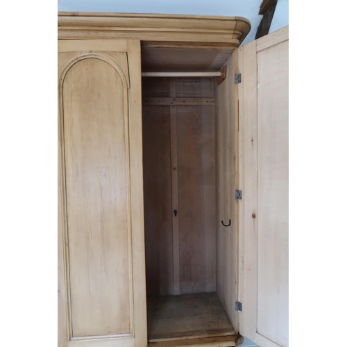 A 19th century tall pine double wardrobe with a base drawer - Width ...