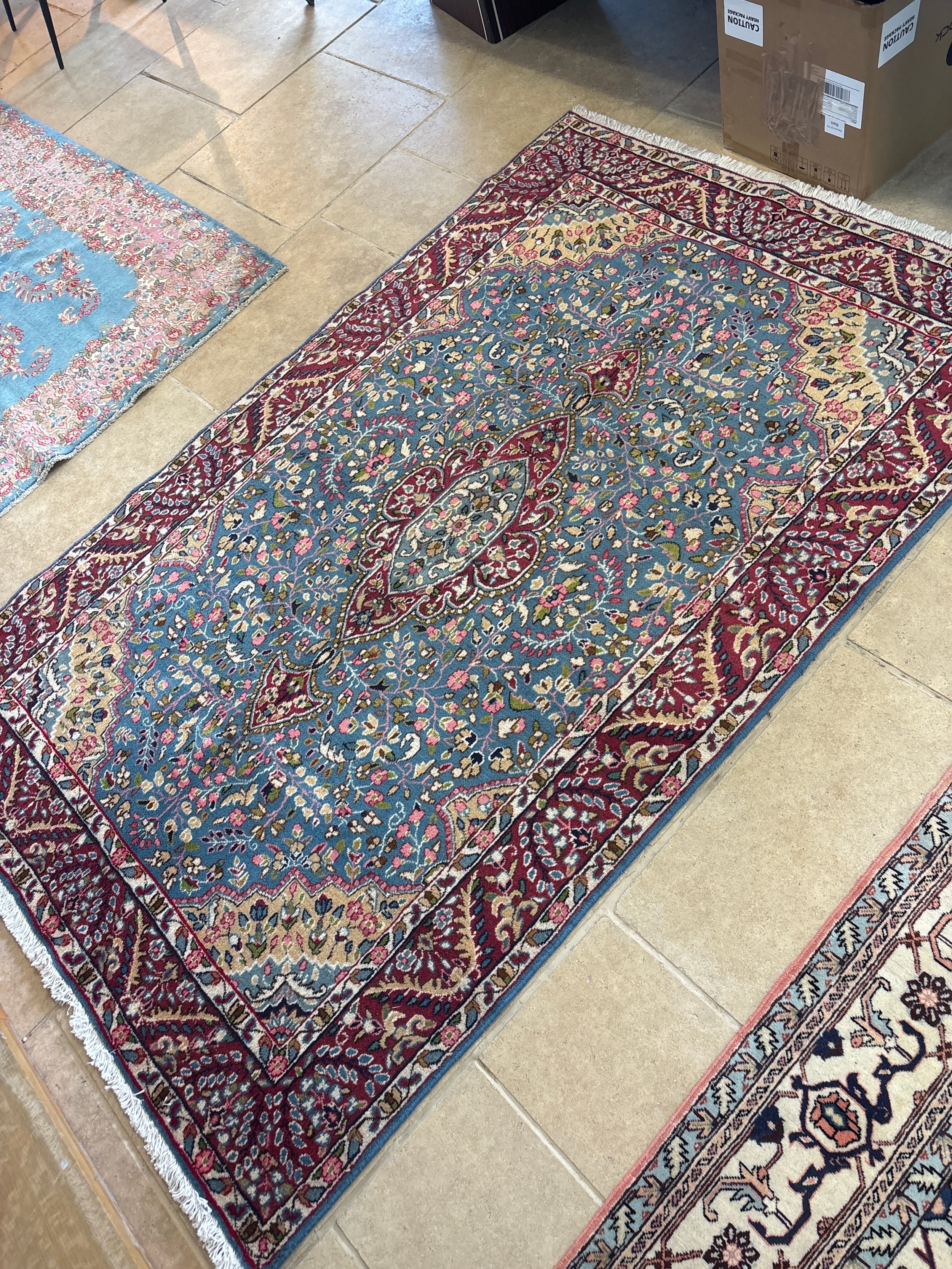 A hand knotted woollen Kirman rug - 2.25m x 1.46m