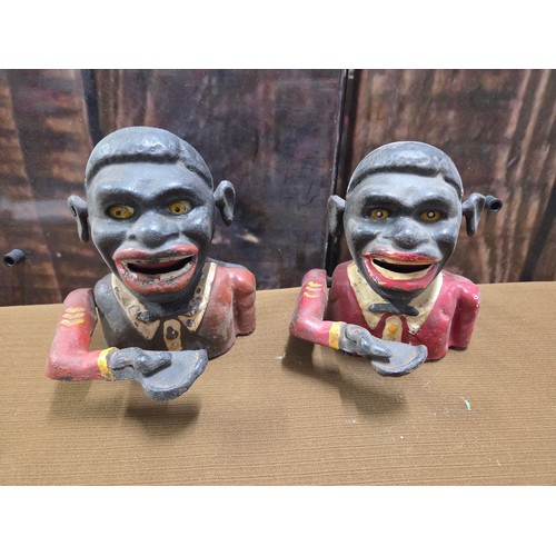 Two vintage Jolly Man money boxes
