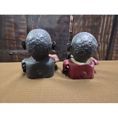 Two vintage Jolly Man money boxes