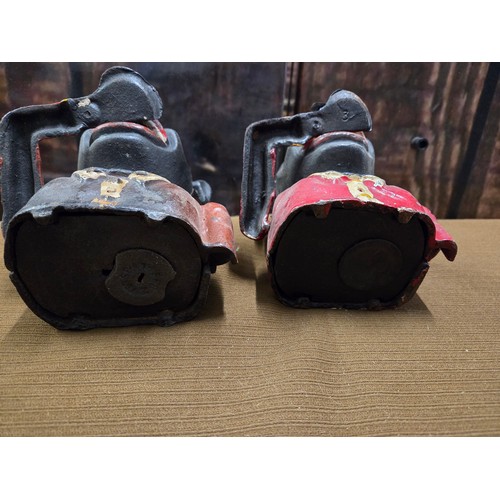 Two vintage Jolly Man money boxes