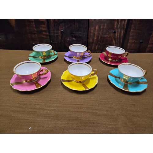 A set of Bavarian Harlequin cups and saucers