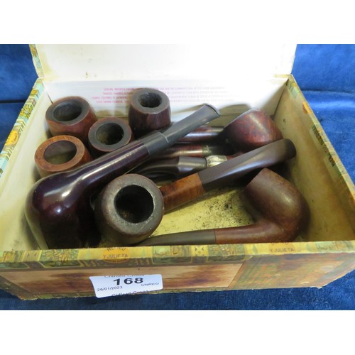 A wooden box of pipes.