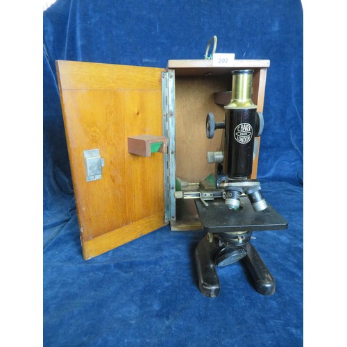 A C. Baker, London microscope in original wooden box with key.