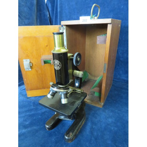 A C. Baker, London microscope in original wooden box with key.
