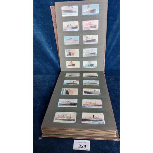 A mid 20th century cigarette card album containing approximately 260 ...