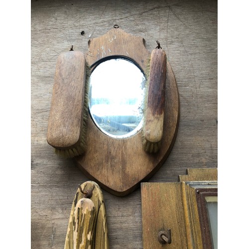 A vintage clothes brush set with mirrored hanger, a clothes brush and ...