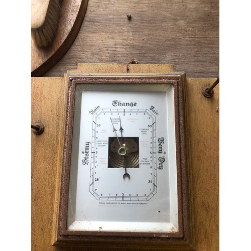 A vintage clothes brush set with mirrored hanger, a clothes brush and ...