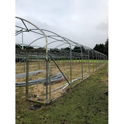 A 5 span galvanised pole and timber polytunnel with drainage guttering ...