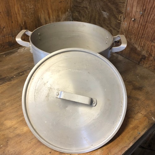 An aluminium cooking pot and lid 38cm diameter