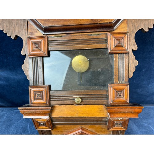 An antique oak wall clock having octagonal shaped clock face surround ...