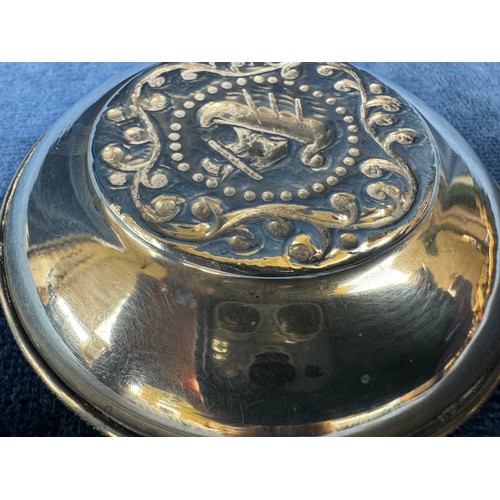 A small circular dish with central image of a boat with floral surround ...