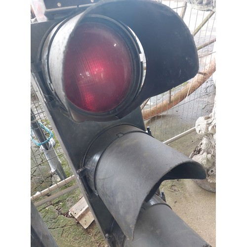##2 ROAD TRAFFIC LIGHT HEADS USED AS A GARDEN FEATURE