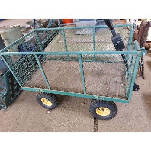 A GARDEN TROLLEY MOUNTED ON 4 WHEELS, FRONT WHEELS ON TURNING PIVET ...
