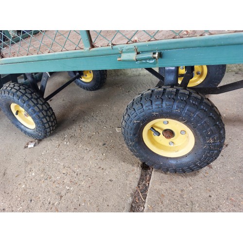 A GARDEN TROLLEY MOUNTED ON 4 WHEELS, FRONT WHEELS ON TURNING PIVET ...