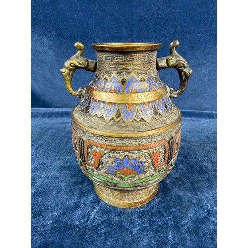 A Japanese bronze champleve enamel vase with twin handles and floral ...