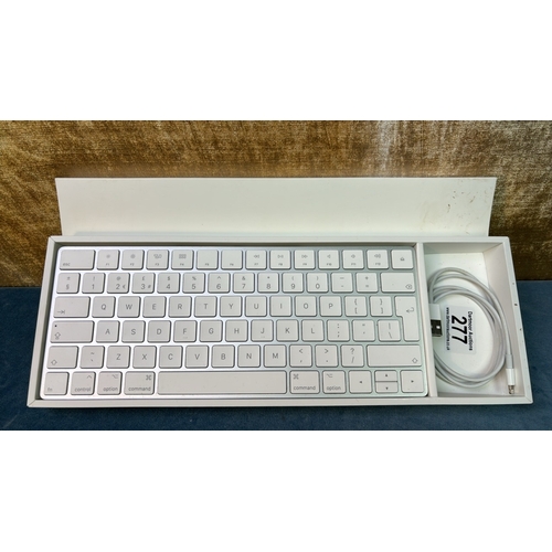 Boxed Apple keyboard with cable