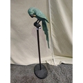 Heavy metal sculpture of a parrot on a stand. Possibly made from solid ...