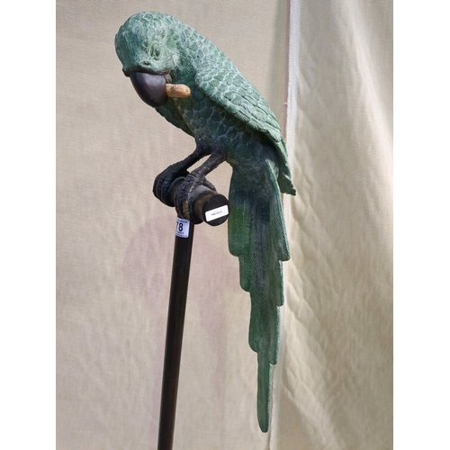 Heavy metal sculpture of a parrot on a stand. Possibly made from solid ...