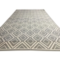 JONATHAN ADLER WOVEN CARPET, 555cm x 361cm.