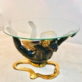 CHERUB COFFEE TABLE. painted metal base with a circular glass top, 42cm ...