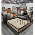 1990s CONRAN WROUGHT IRON BED. With scrolling metalwork frame and divan ...