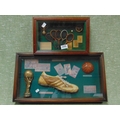 Two framed and glazed dioramas, a football and a tennis themed example. (2)
